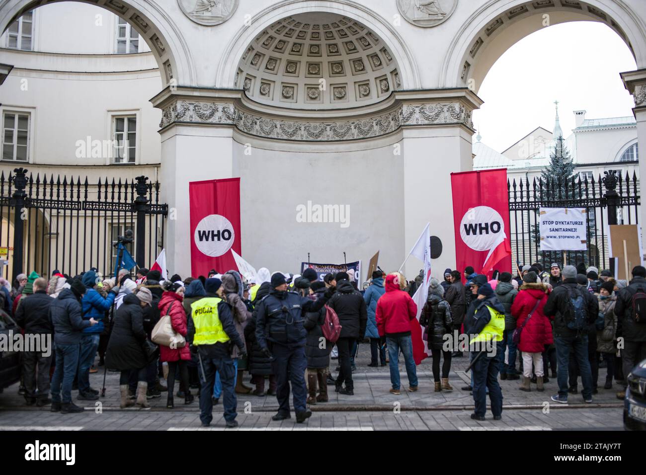 Protesters hold placards with anti-WHO slogans during the demonstration ...