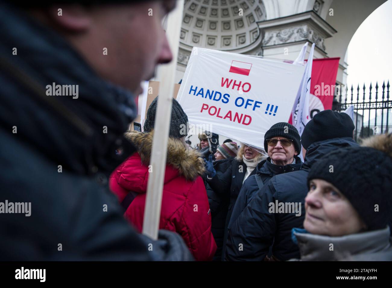 Protester holds a placard with anti-WHO slogans during the ...