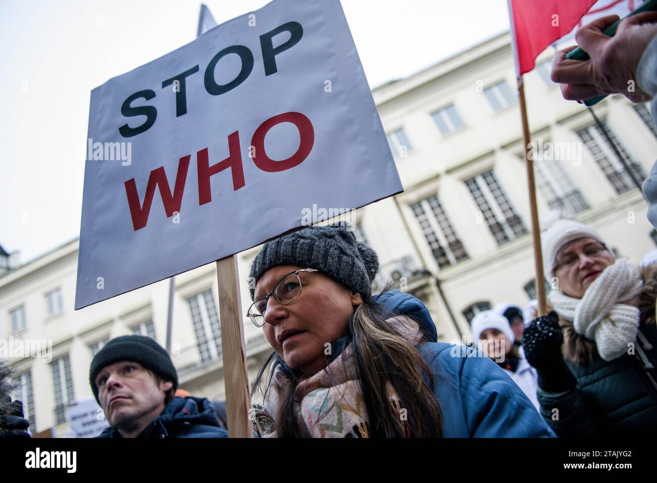 Protester holds a placard with anti-WHO slogans during the ...
