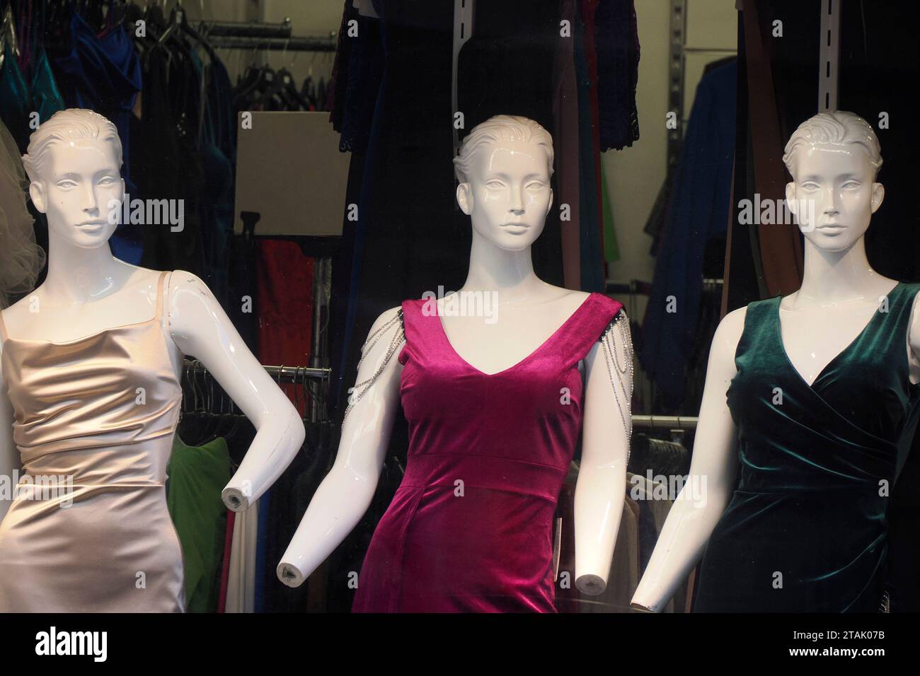 Three woman mannequin in shop window Stock Photo - Alamy