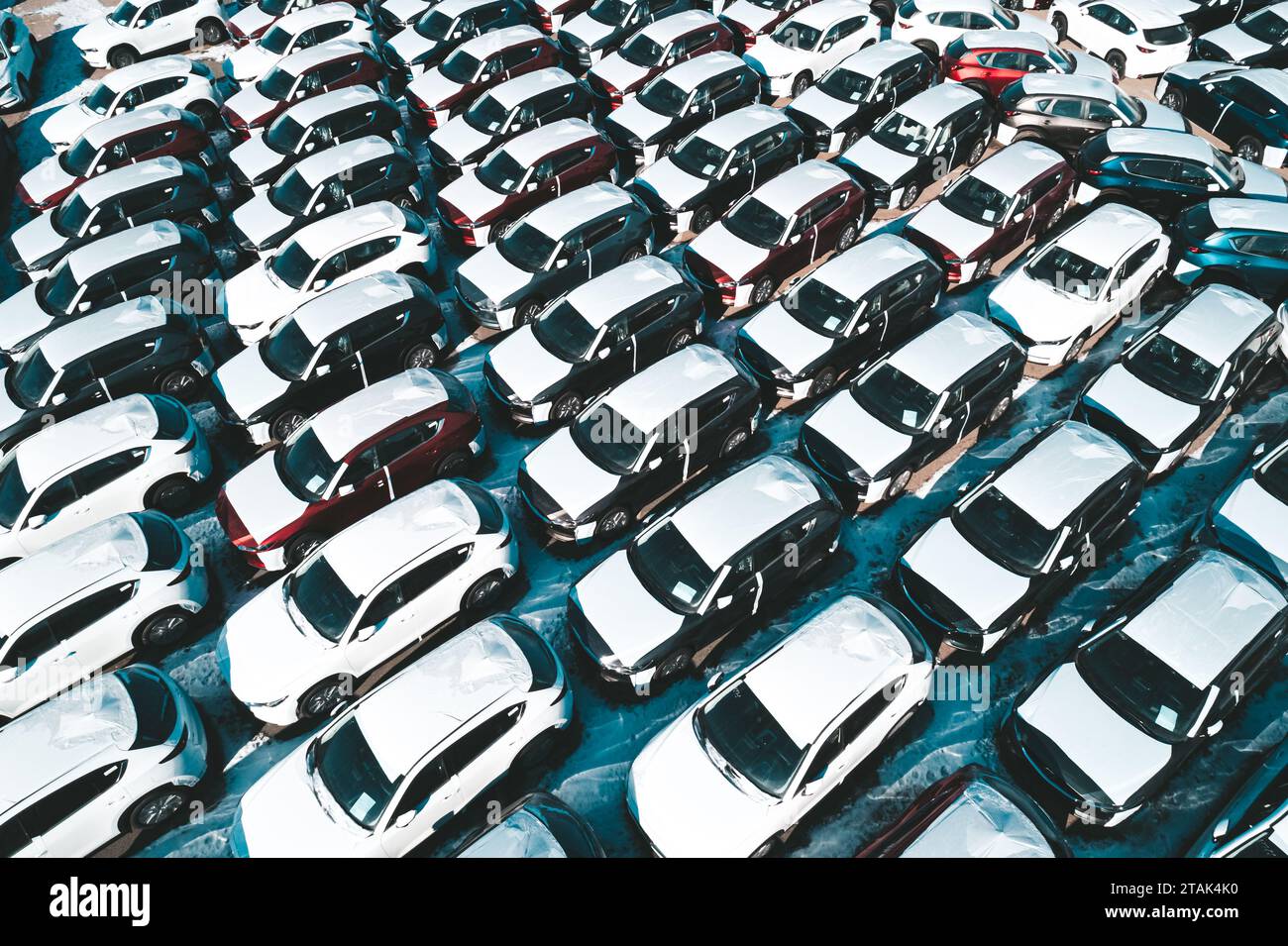 Aerial view of new cars parked in car parking lot. Car dealer parking ...