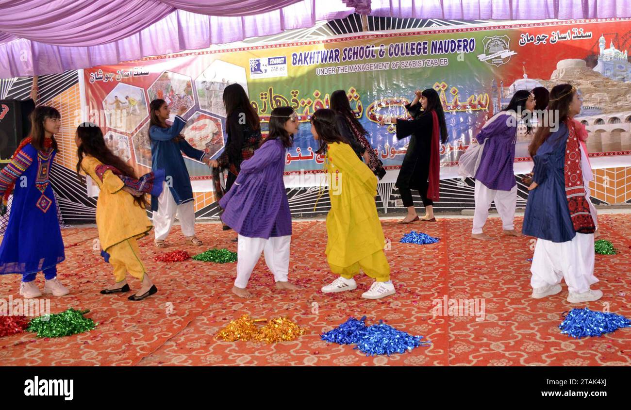 Students are performing tableau on stage during a ceremony on the eve ...