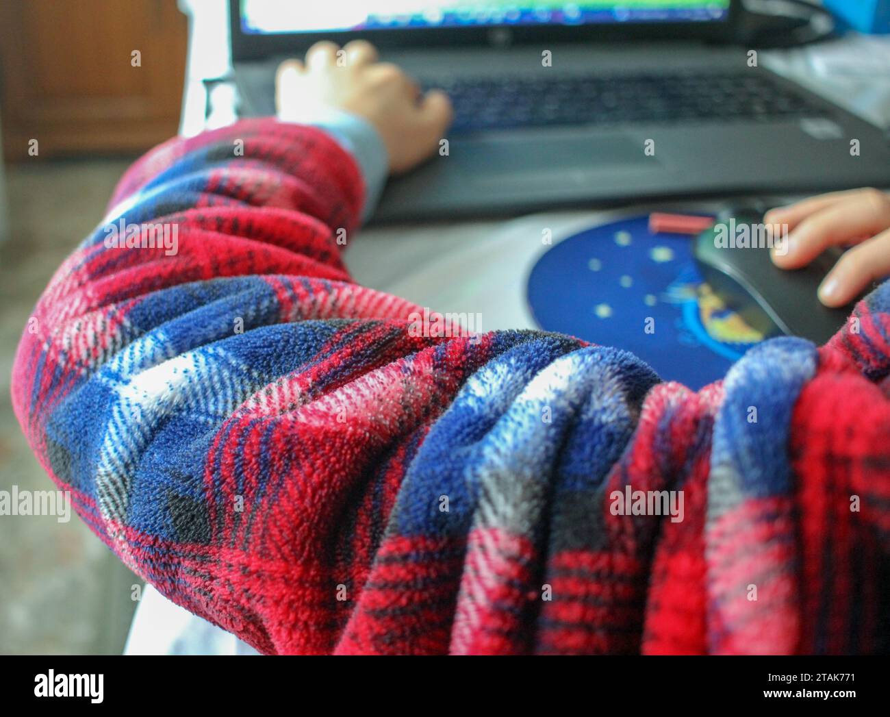 Kid typing laptop hi-res stock photography and images - Alamy