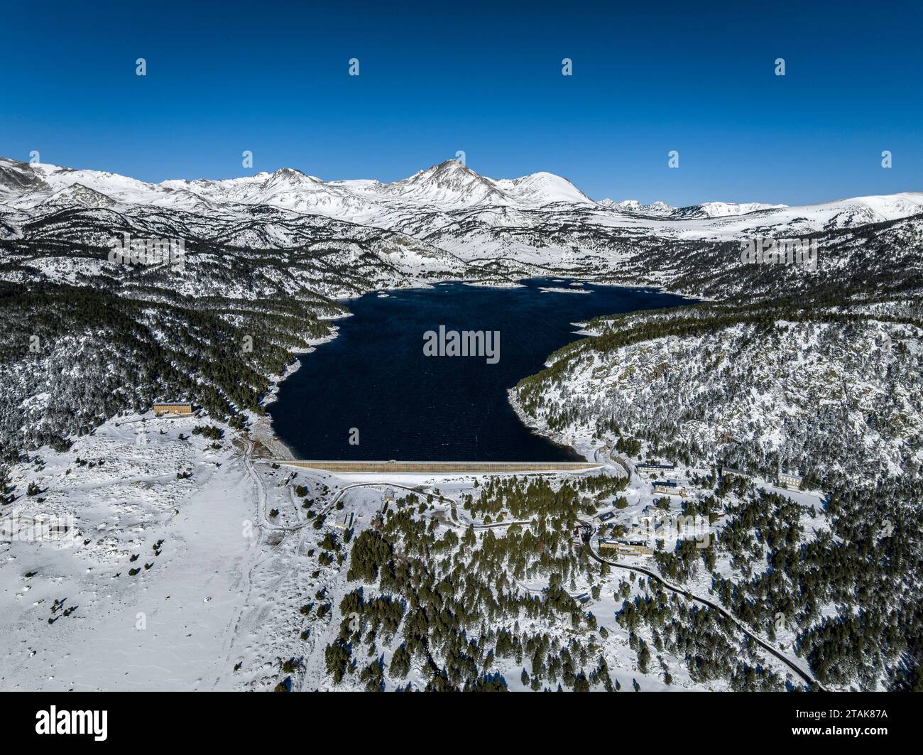 Aerial view of the Bouillouses lake after a snowfall in early winter ...