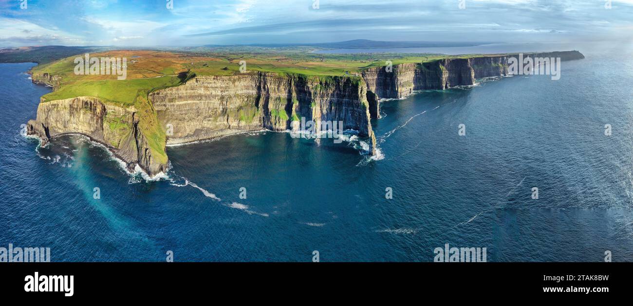 Aerial panoramic view of the Cliffs of Moher near sunset along the ...