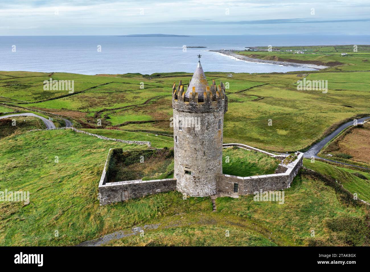 Aerial view of Doonagore Castle, a round 16th-century tower house with ...
