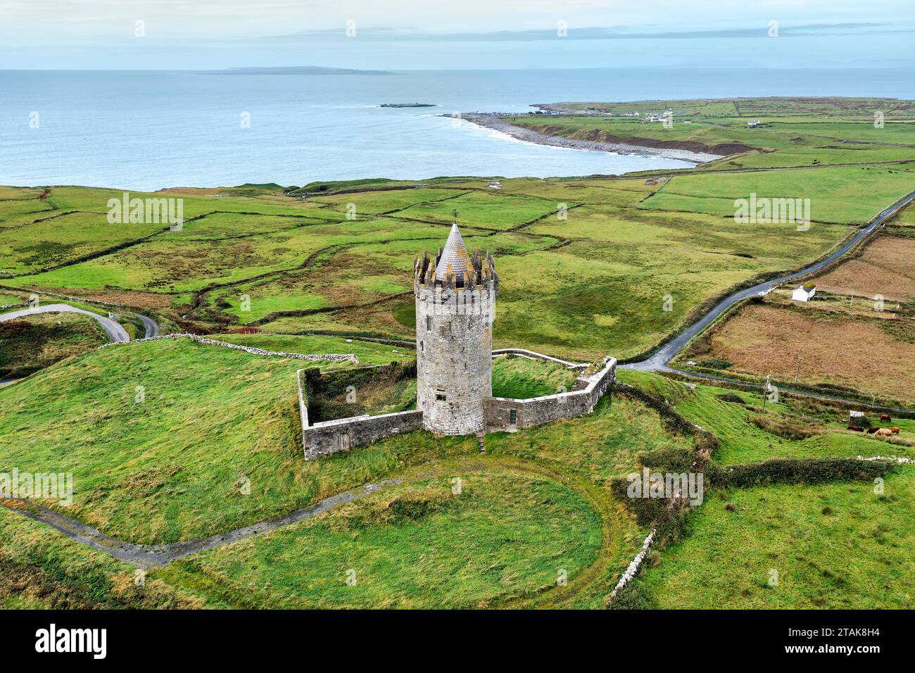 Aerial view of Doonagore Castle, a round 16th-century tower house with ...