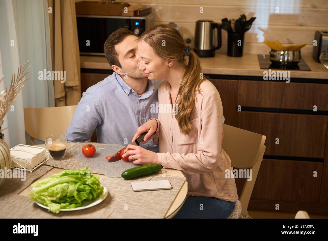 Cute romantic couple cooking together in kitchen Stock Photo - Alamy