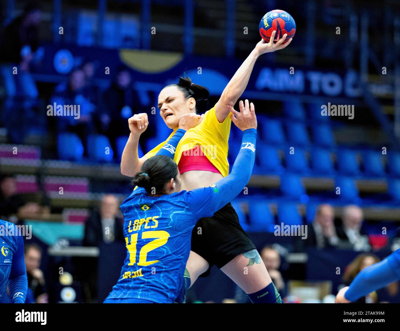 Jennifer Rosa Lopes from Brazil stops Kristina Radayeva from Kazakhstan during the IHF World ...