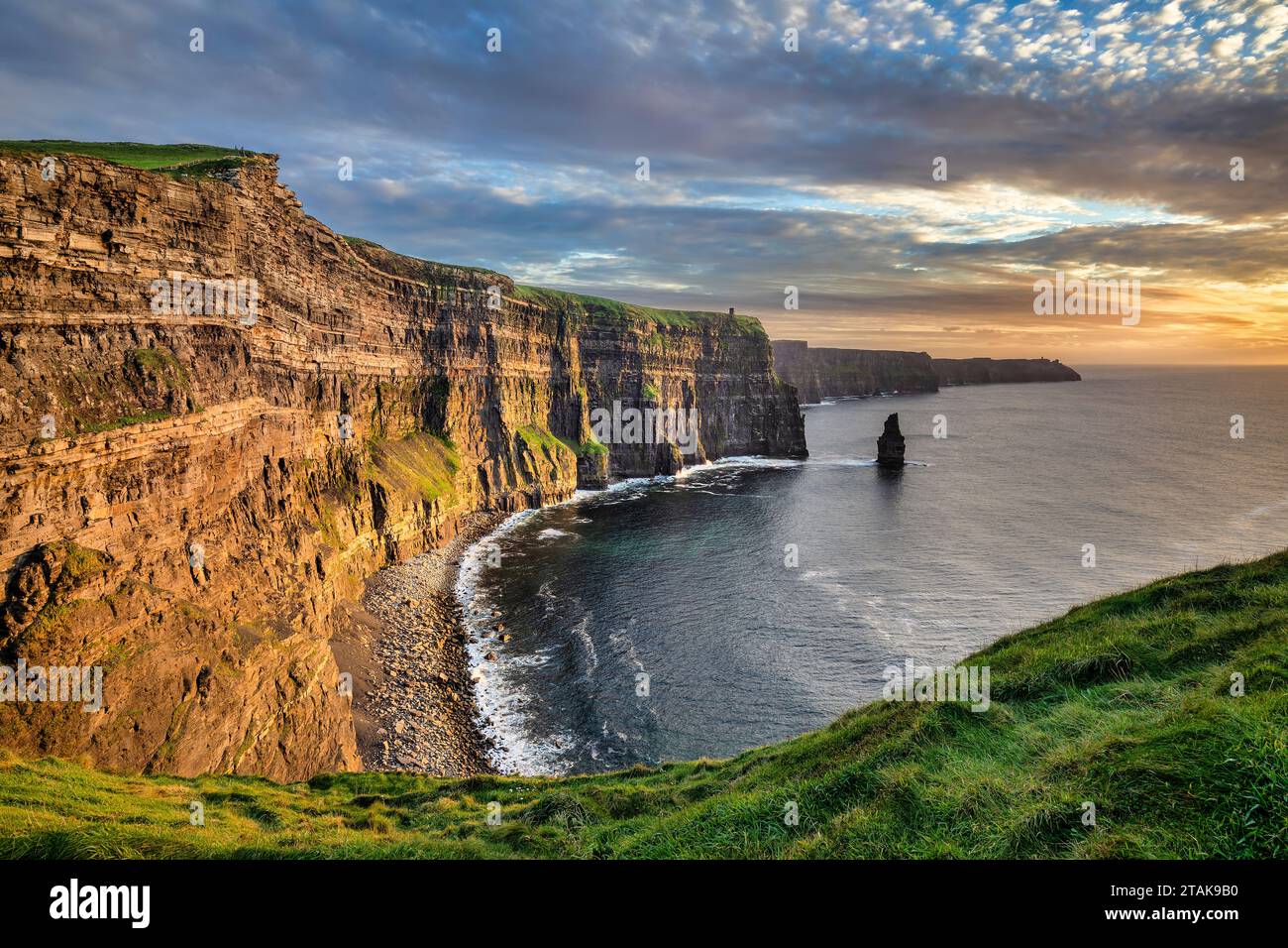 Sunshine illuminates the coastline along the Cliffs of Moher just ...