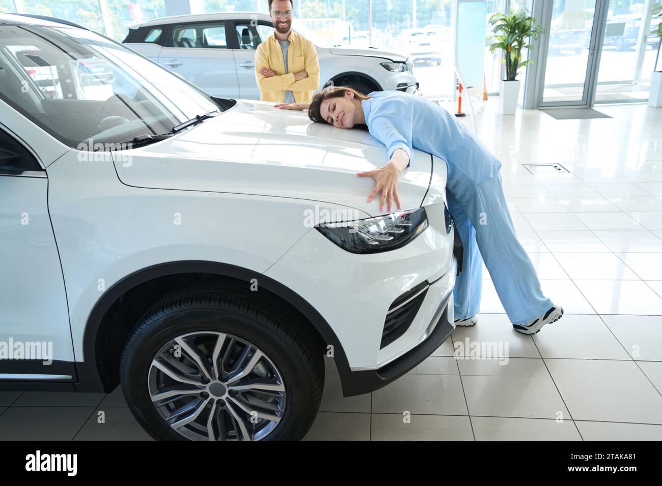 Photo of beautiful female in car showroom Stock Photo - Alamy