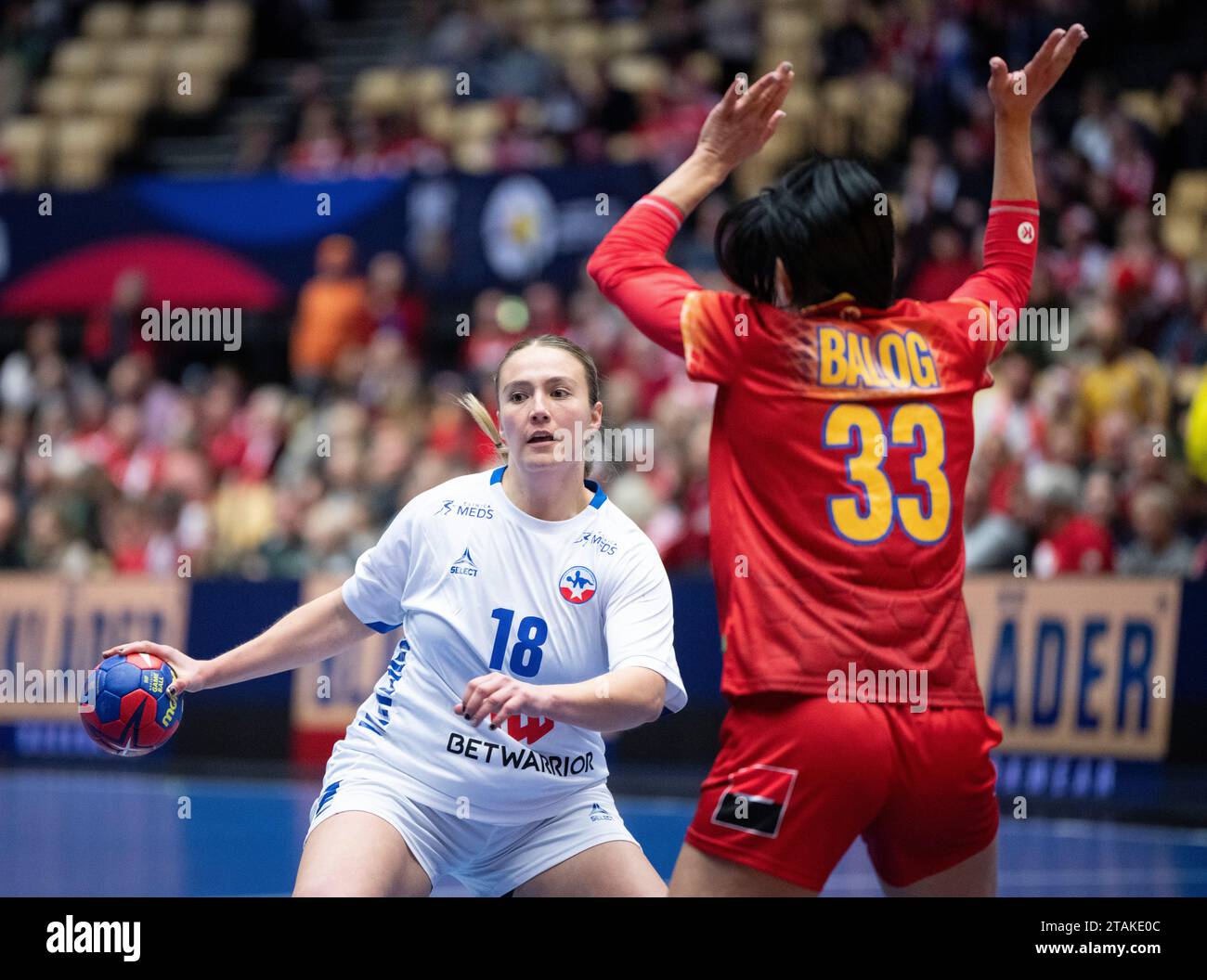 Maria Elena Correa Vergara of Chile in action with Nicoleta Balog of Romania during the IHF ...