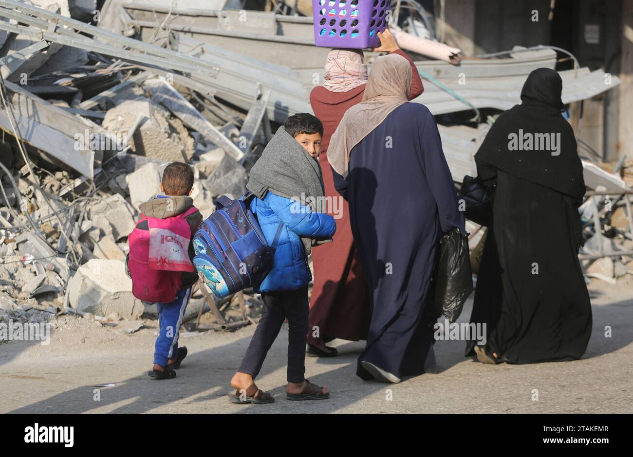 Gaza, Palestine. 01st Dec, 2023. A Palestinian boy walks with his ...