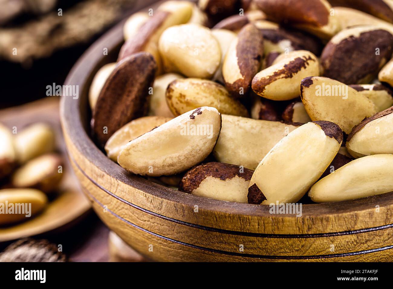 wooden bowl with many Bertholletia excelsa, popularly known as chestnut ...