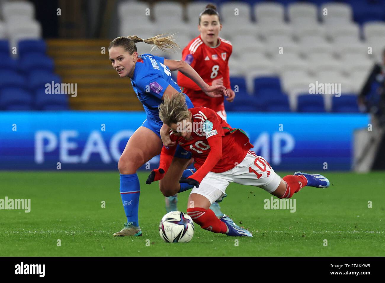 Cardiff, UK. 1st Dec, 2023. Jess Fishlock of Wales is fouled Hildur ...