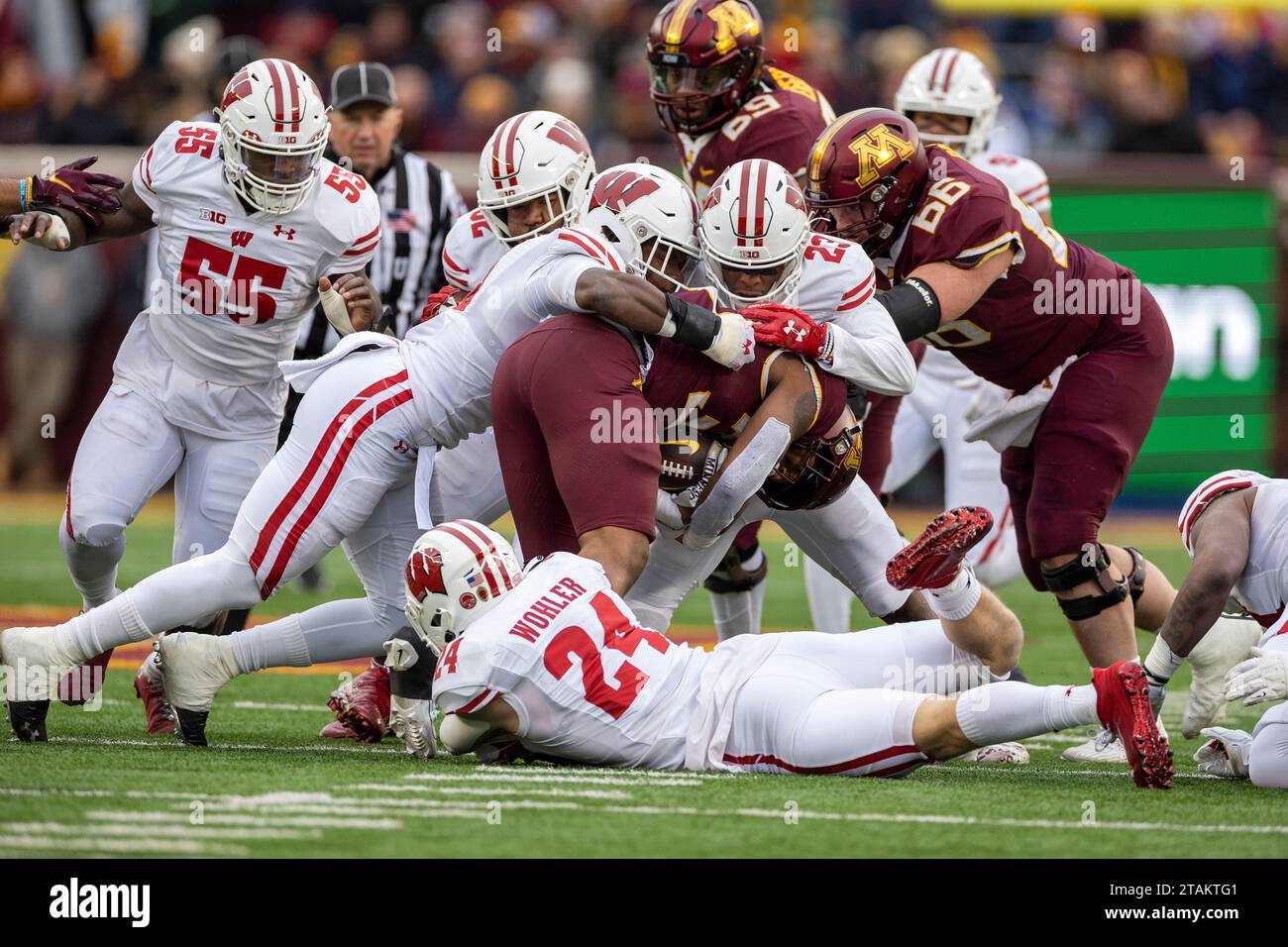 Wisconsin Badgers defense makes a gang tackle during a Big Ten ...