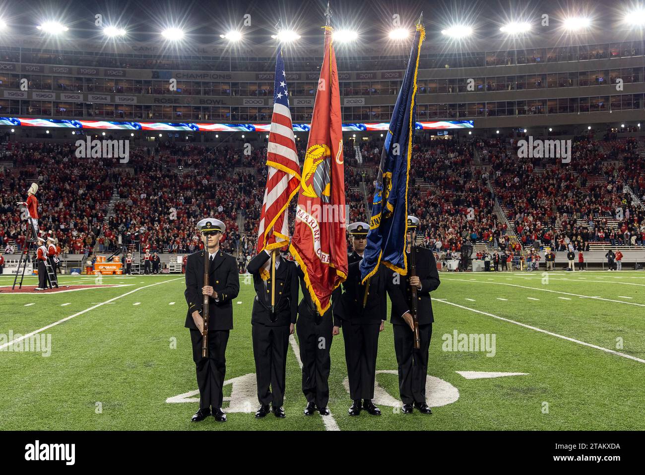 University of Wisconsin Navy ROTC Color Guard presents the flags during ...