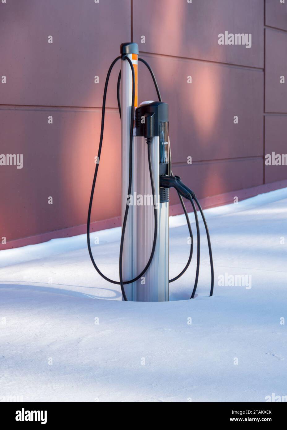 EV charging station for zero emission cars in white snow pile Stock ...