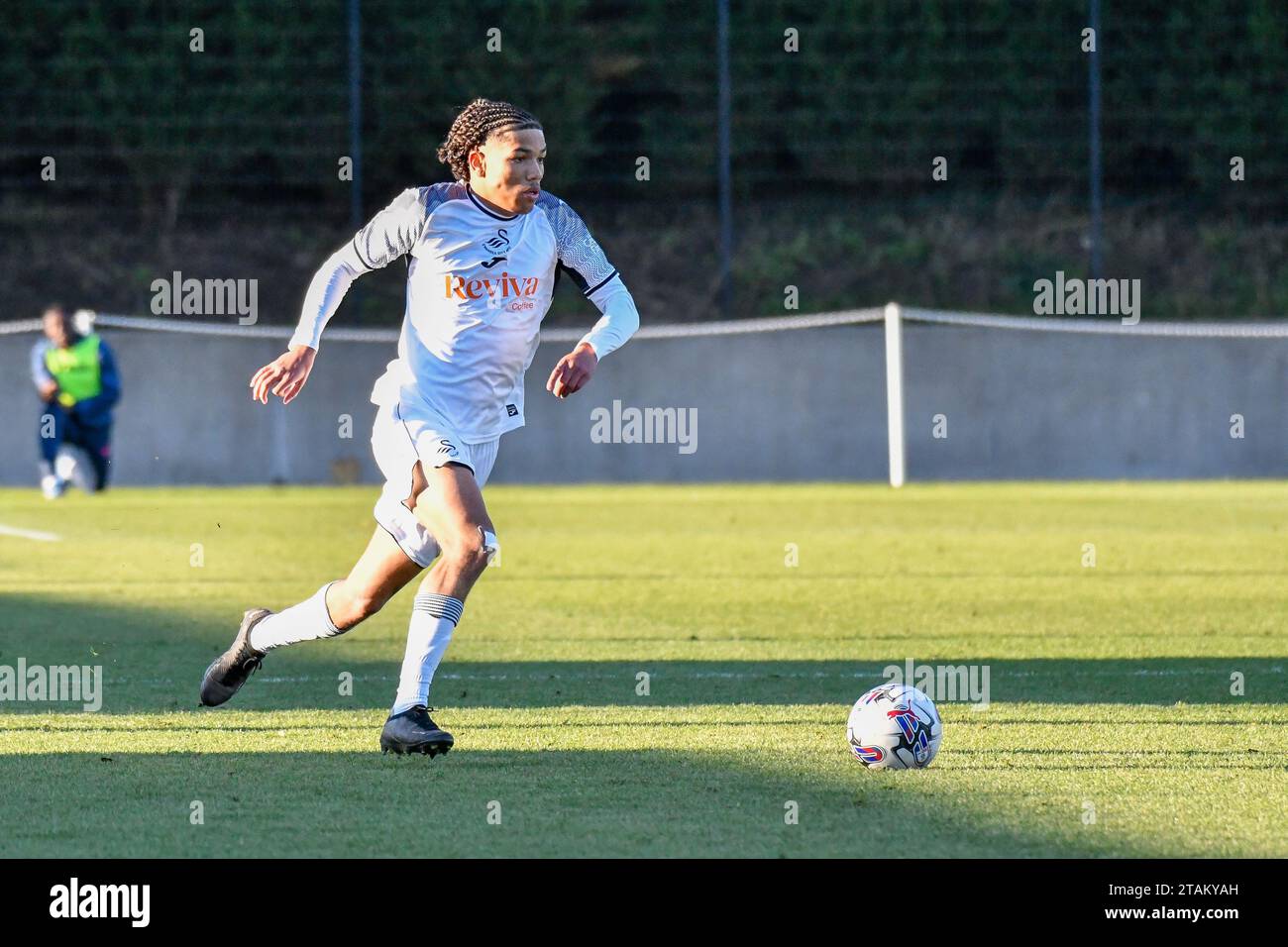 Swansea, Wales. 1 December 2023. Kyrell Wilson of Swansea City goes on ...
