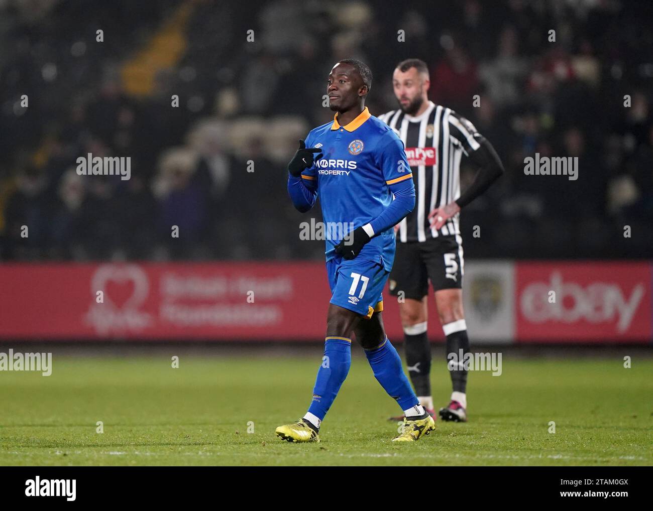 Shrewsbury Town's Daniel Udoh (right) complains to the referee after an ...