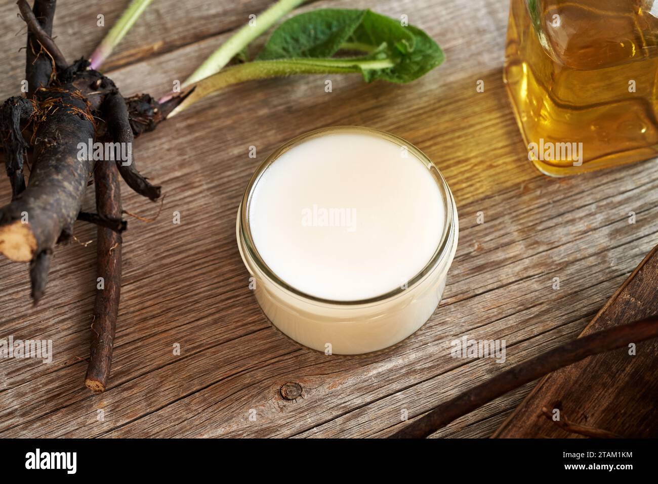 Comfrey root ointment in a glass jar Stock Photo - Alamy