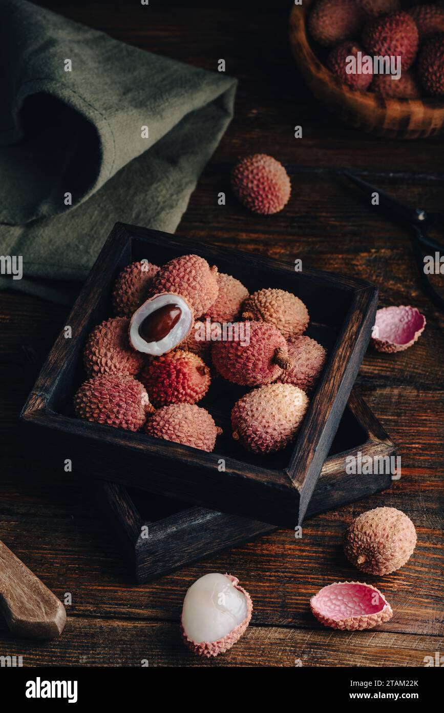 Delicious Fruits of Lychee in Rustic Box Stock Photo - Alamy