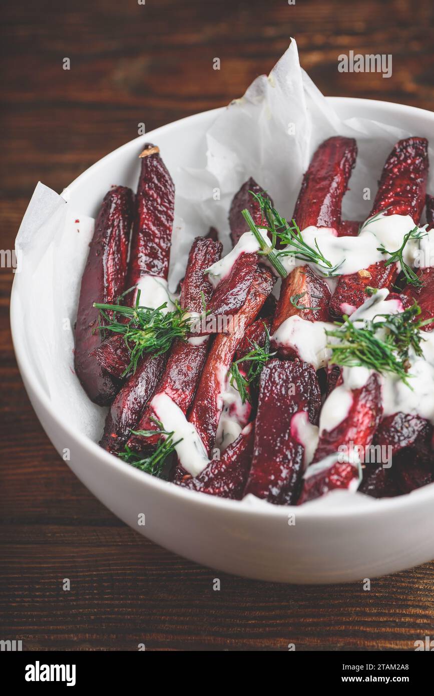 Oven baked beet fries with greek yogurt and dill dressing Stock Photo ...