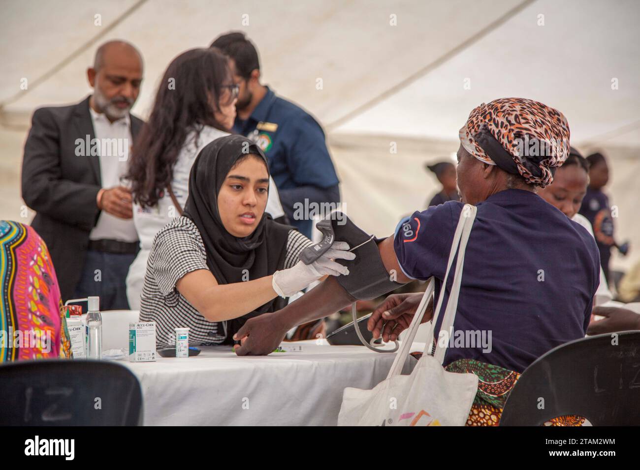 Lusaka, Zambia. 1st Dec, 2023. A woman has her blood pressure taken ...