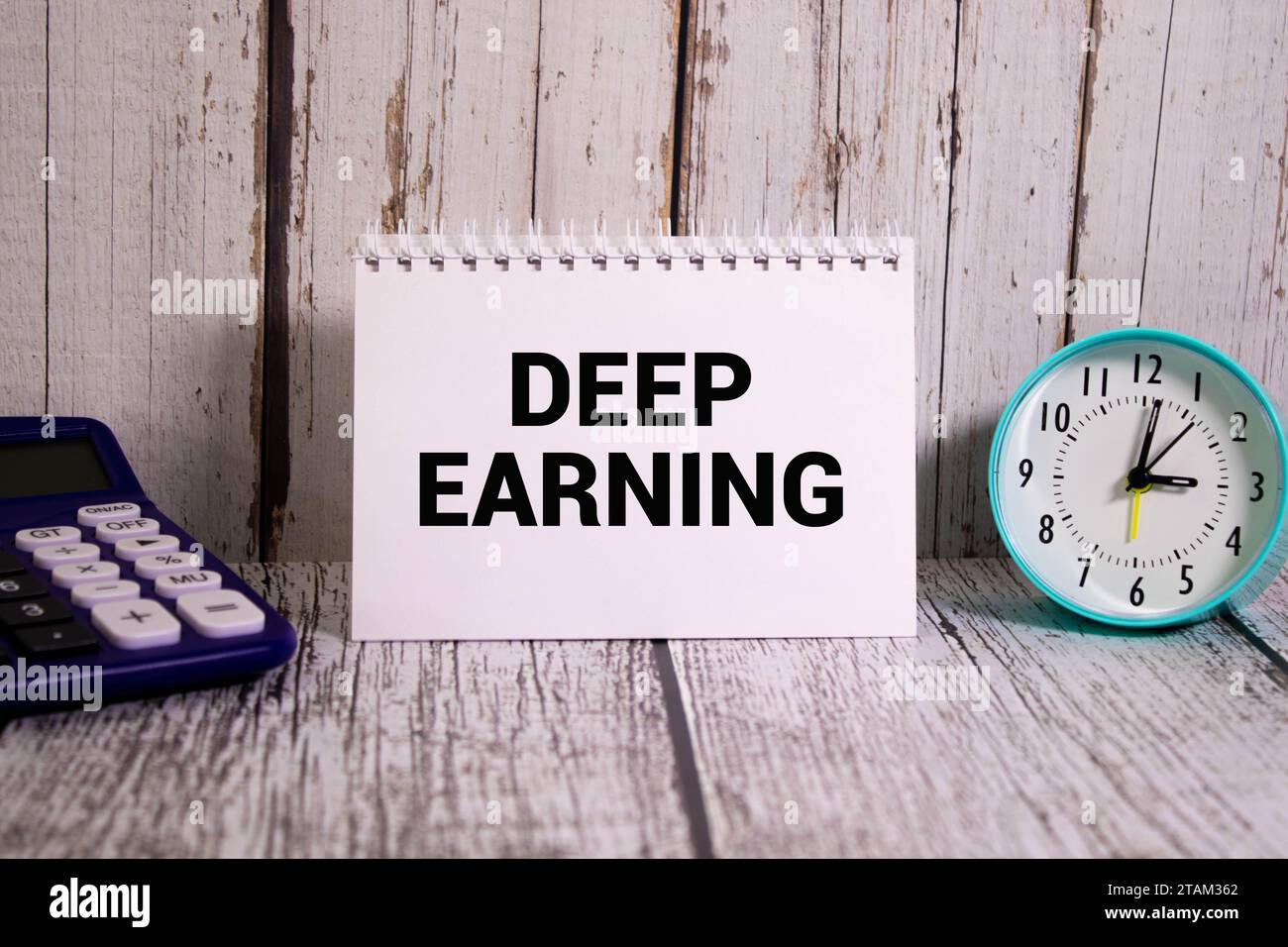 DEEP LEARNING text on a paper with keyboard, calculator on grey ...