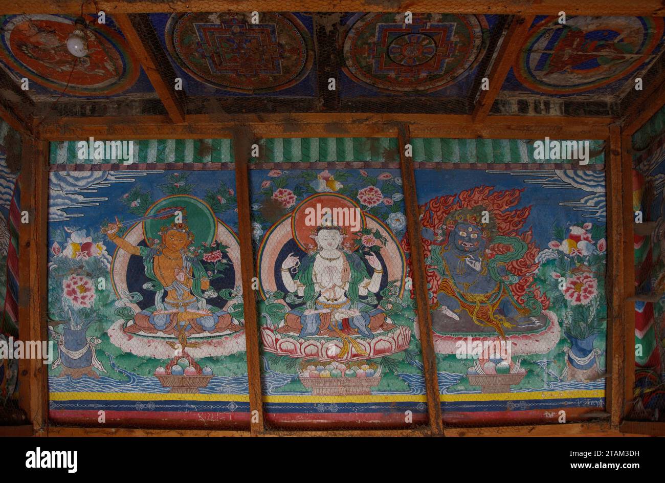 Tibetan Buddhist mural of Chenrezig and Manjushri inside a chorten in ...
