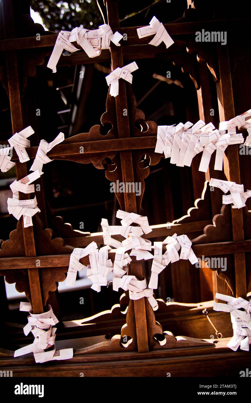 Knotted paper prayers at a temple in Tokyo, Japan Stock Photo - Alamy