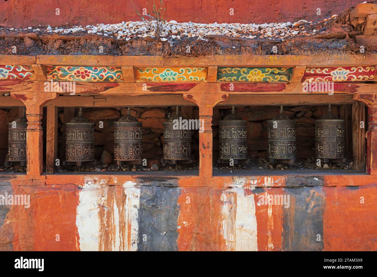 Prayer wheels at the Red Monastery or Kag Chode Thupte Samphel Ling ...