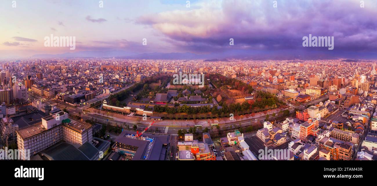 Short aerial cityscape panorama of modern and ancient suburbs of Kyoto ...