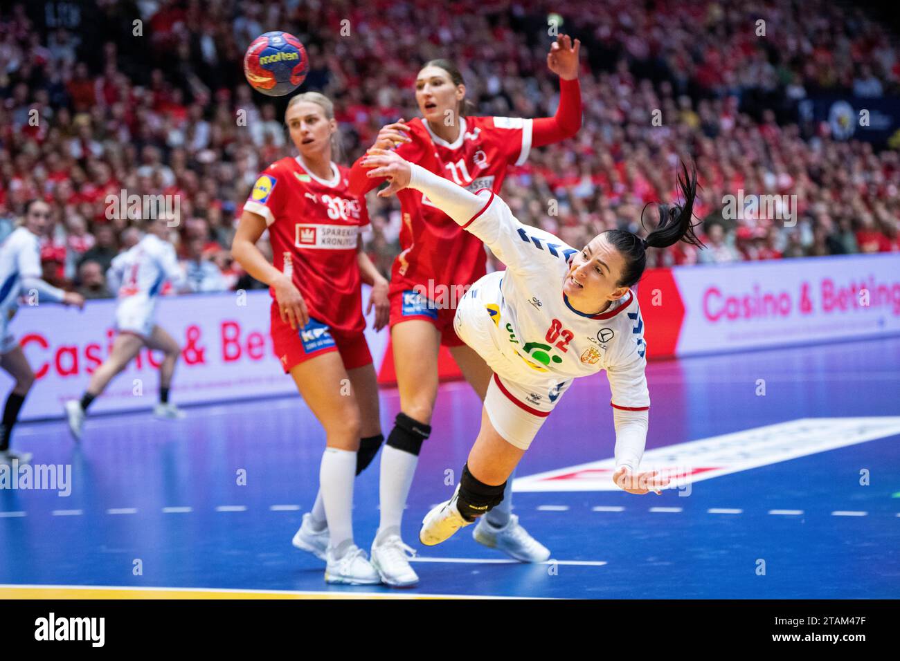 Serbia's Jovana Milojevic fights past Denmark's Line Haugsted and Simone Petersen during the ...