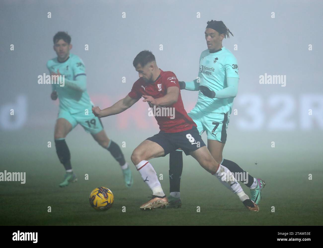 York City's Olly Dyson (left) and Wigan Athletics' Sean Clare battle ...