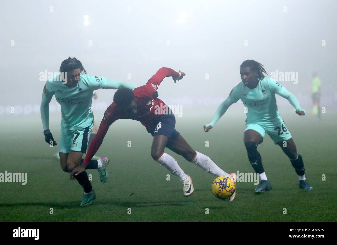 York City's Thierry Latty-Fairweather (centre) and Wigan Athletics ...