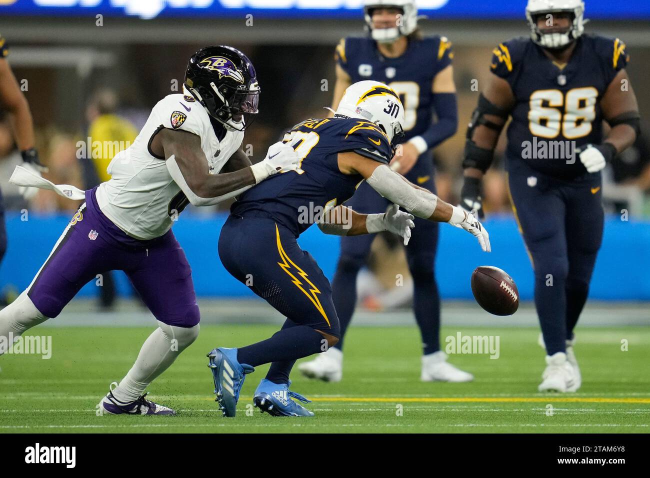 Los Angeles Chargers running back Austin Ekeler (30) fumbles the ball ...