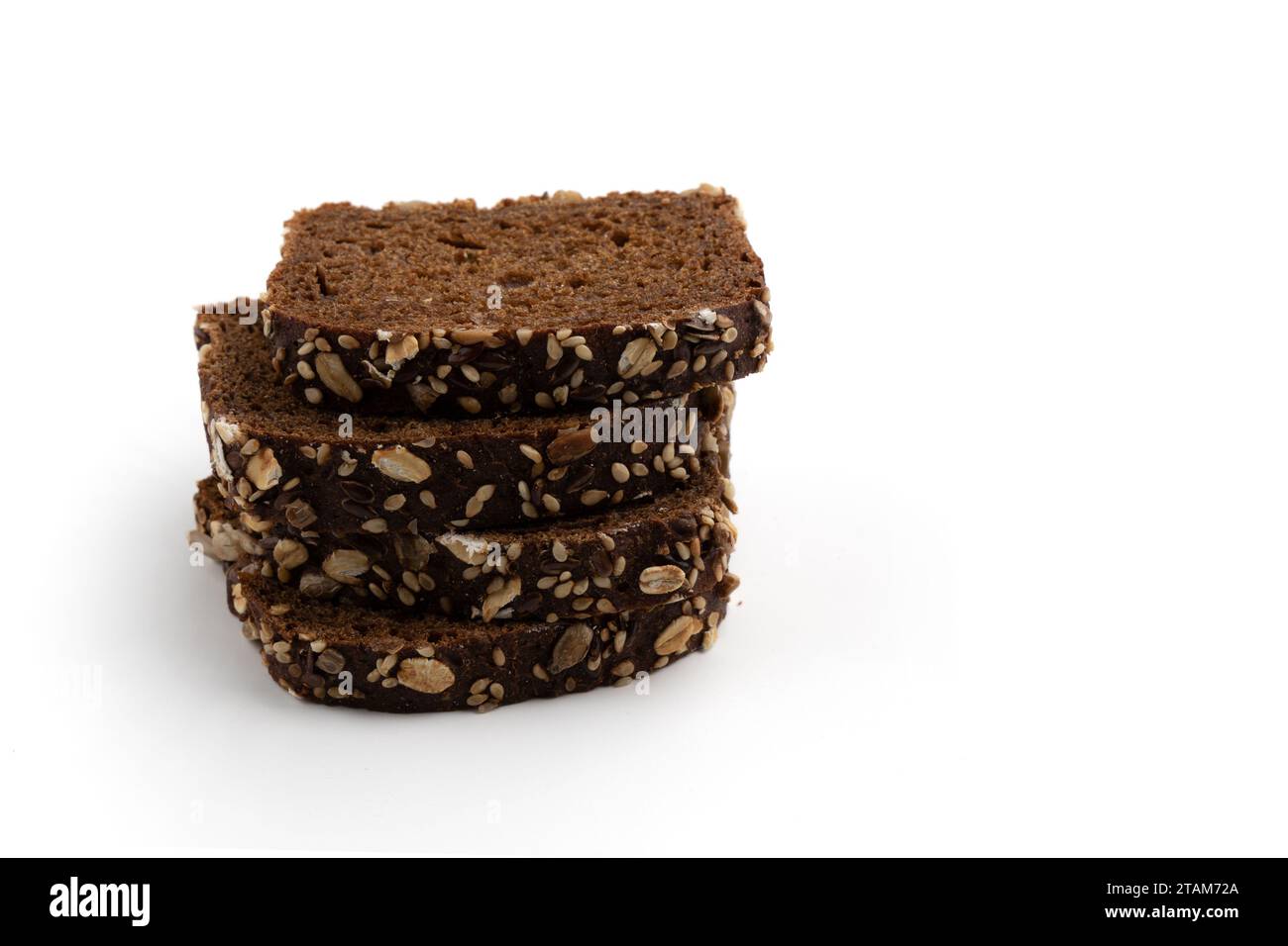 slices of rye bread on white background, side view, heap of fresh ...