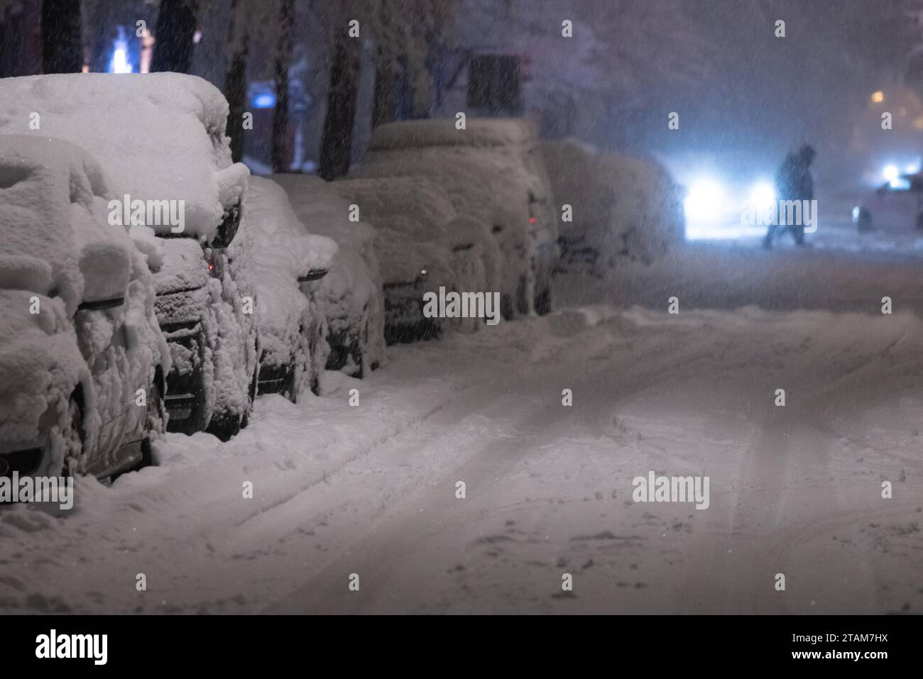 Munich, Germany. 01st Dec, 2023. Passers-by walk across a snow-covered ...