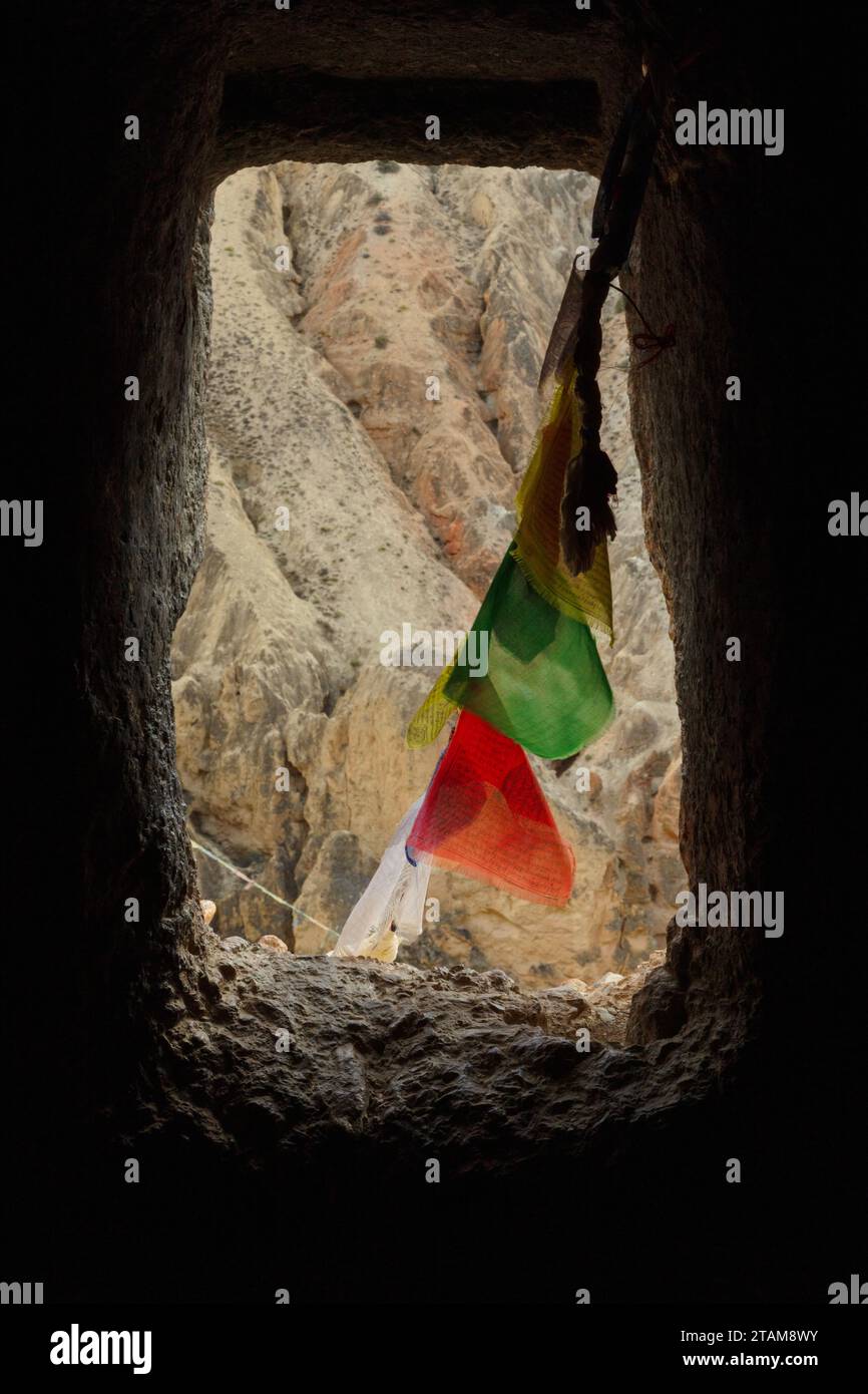 Prayer flags in the caves of Dhakmar which date back to pre historic ...