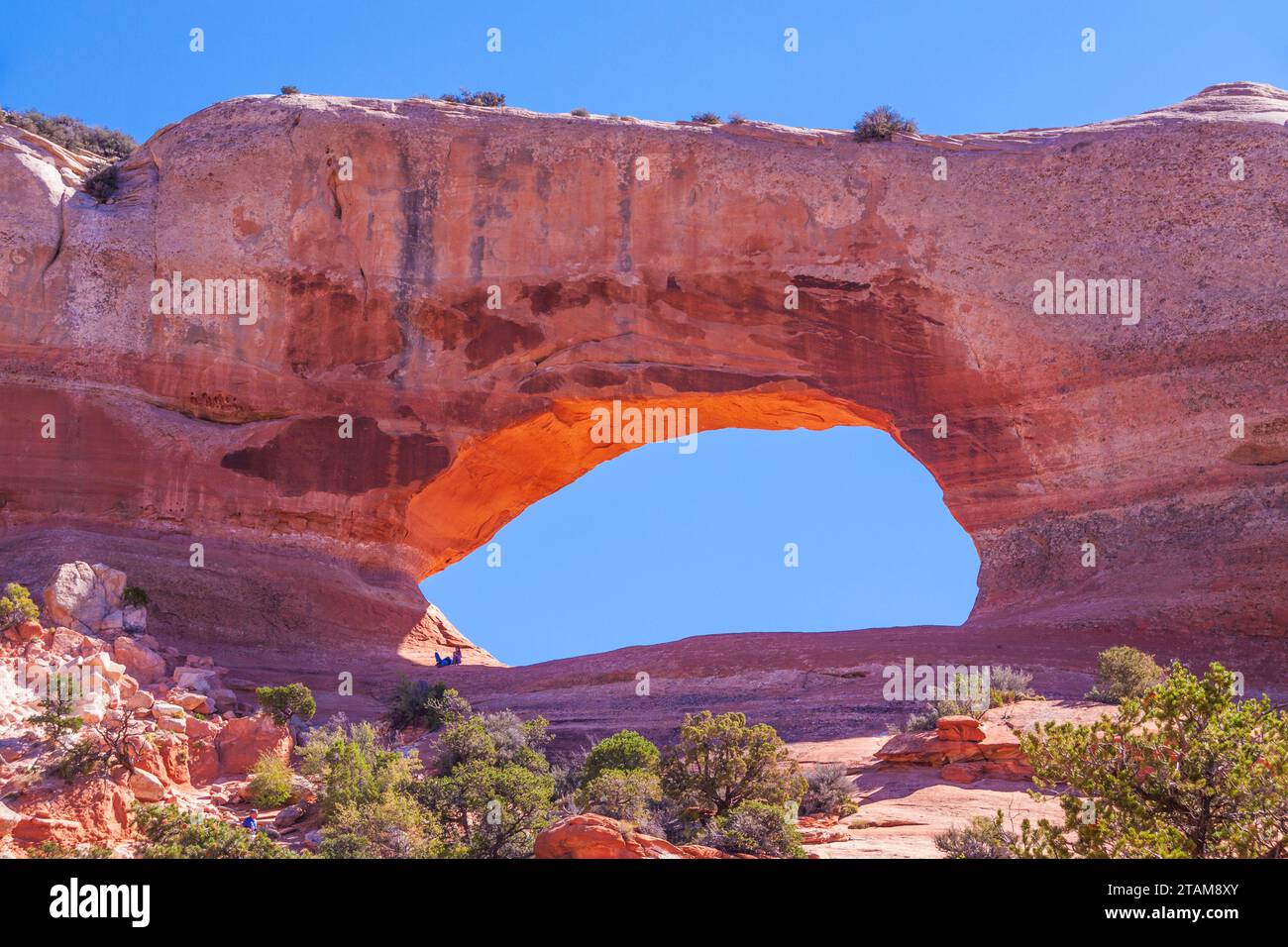 Short trail up a steep slope to a large arch hi-res stock photography ...