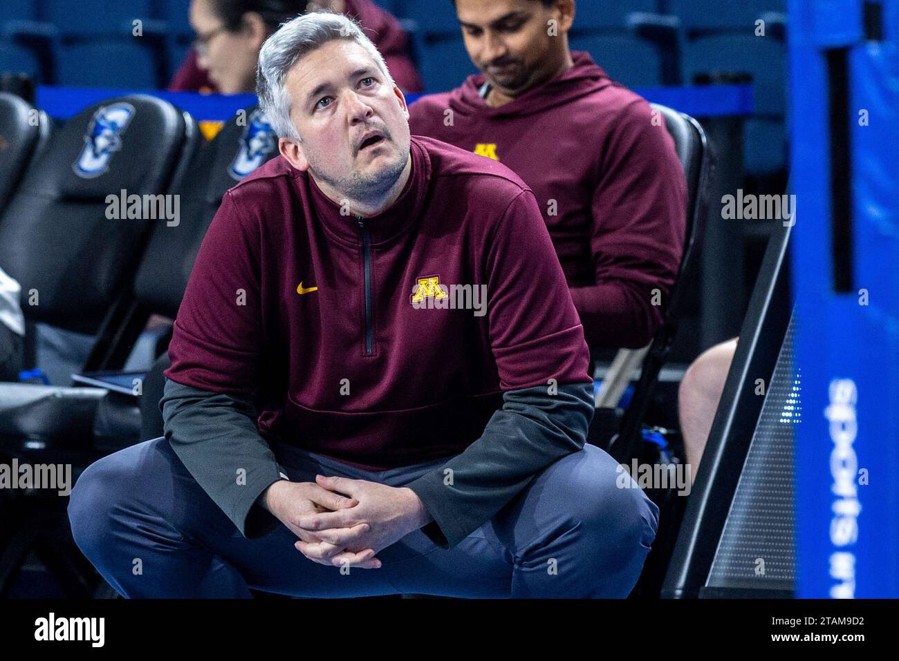 Minnesota cCoach Keegan Cook watches the team take on Utah State during ...