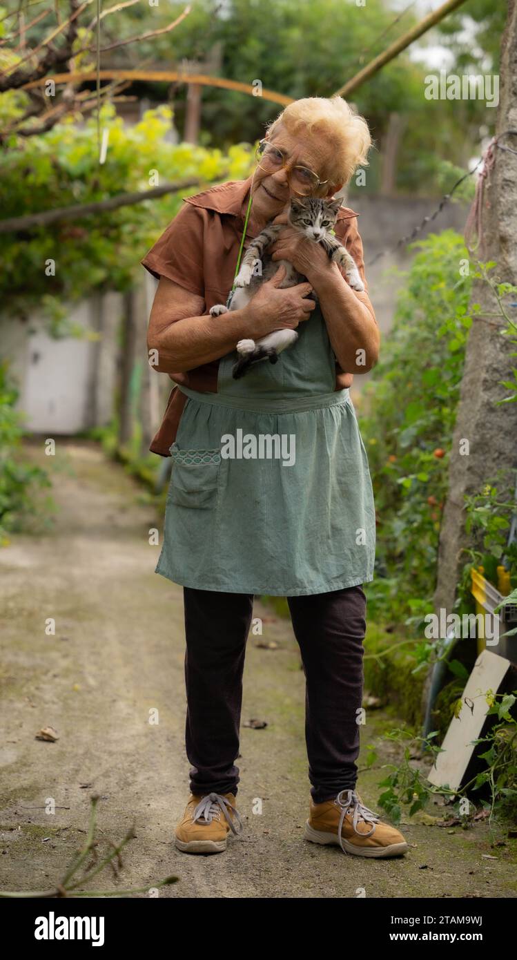 Old lady with cat hi-res stock photography and images - Alamy