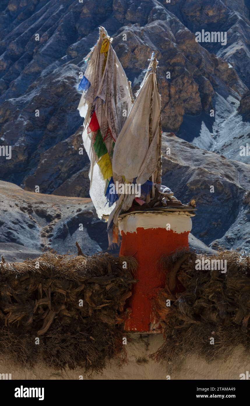 Prayer flags fly with Sam Dzong village is located near the border to ...