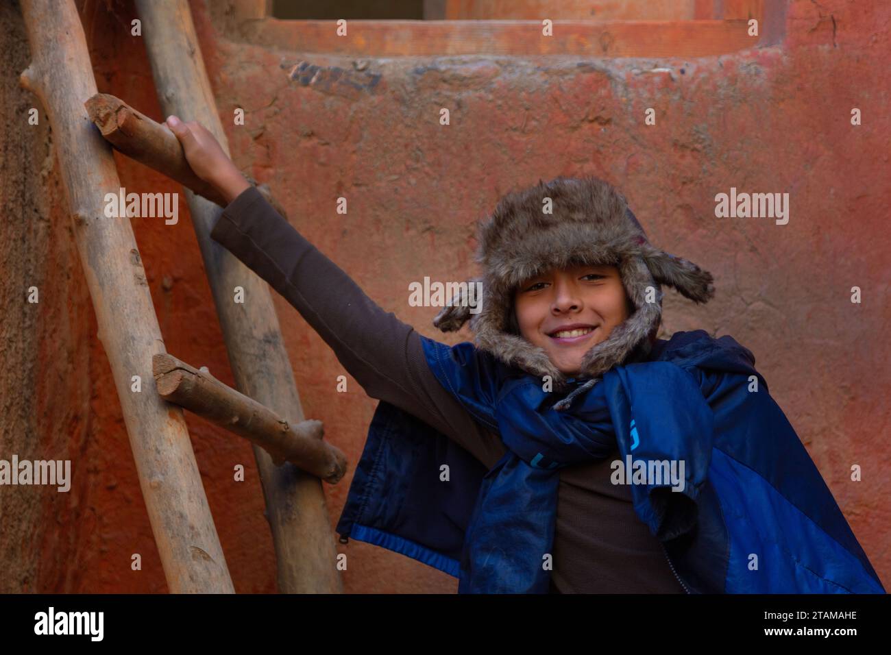 Vajra Garrett on a ladder in Yara village - Mustang District, Nepal ...