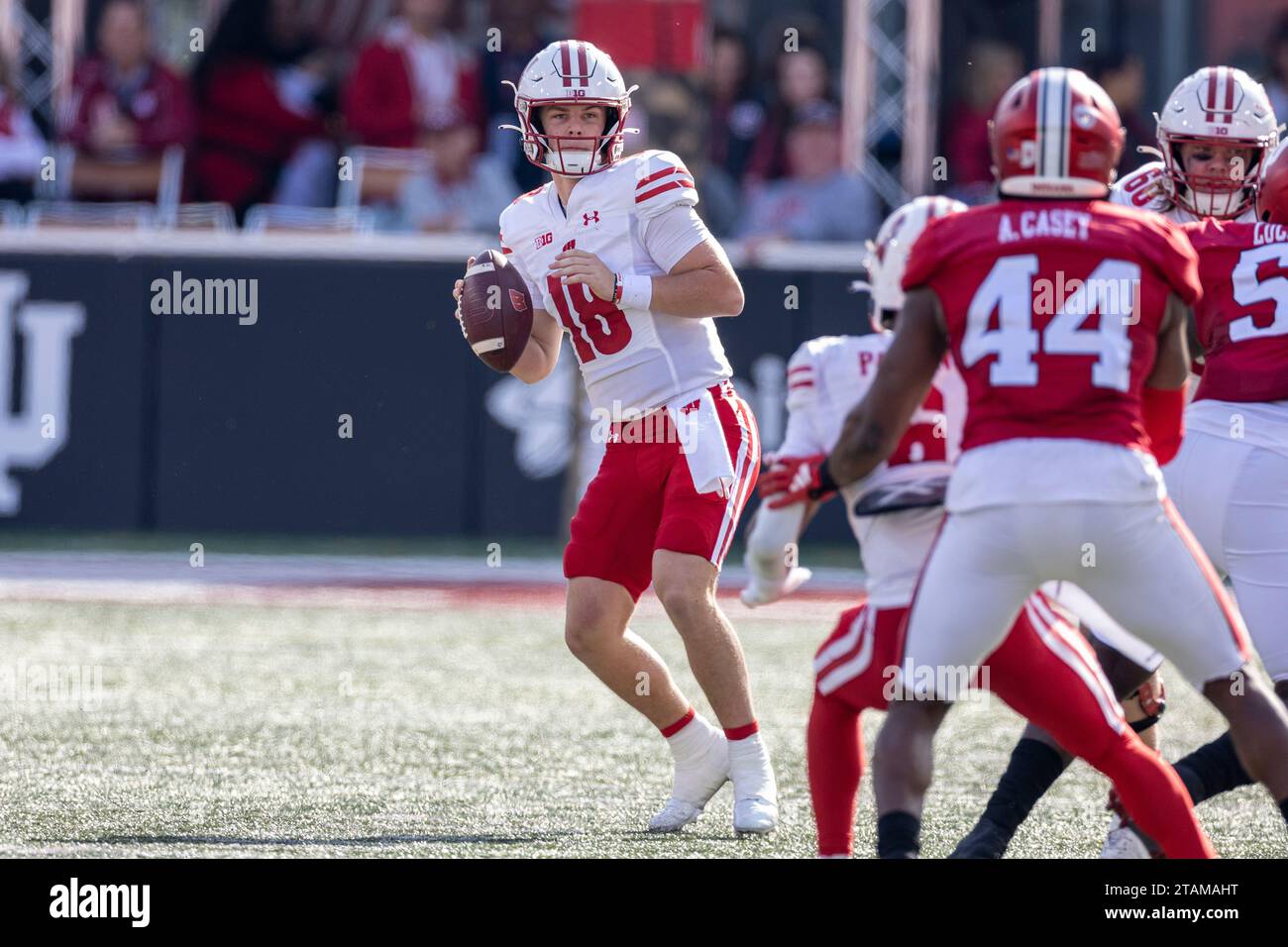 Wisconsin Badgers quarterback Braedyn Locke (18) looks for a receiver ...