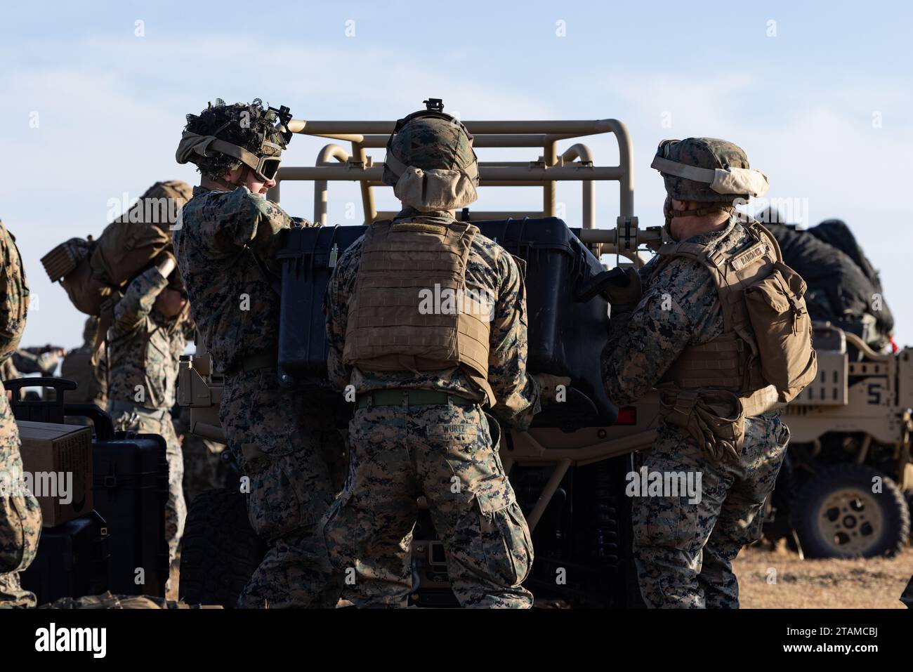 U.S. Marines unload a Marine Corps utility task vehicle in preparation ...