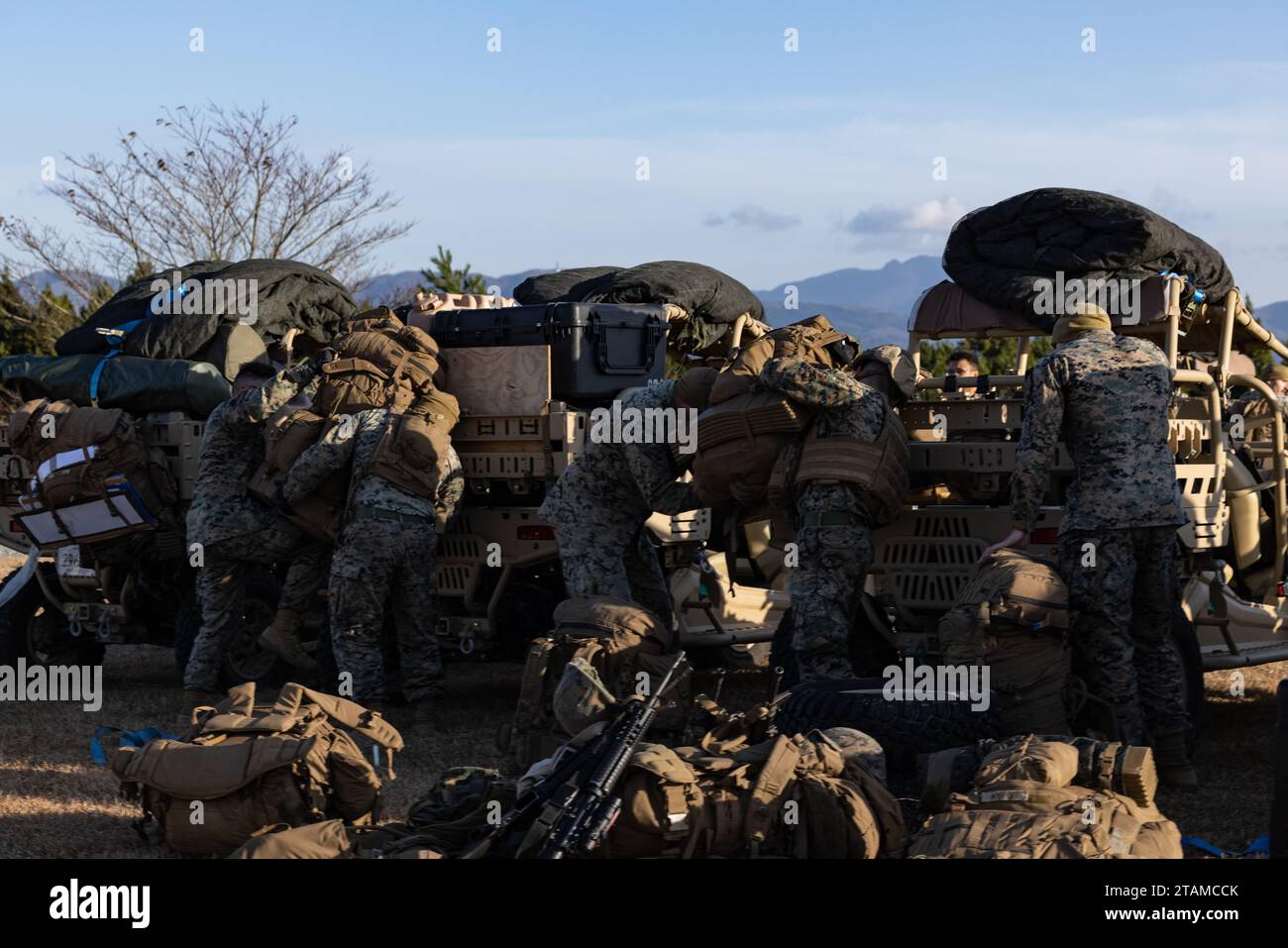 U.S. Marines unload a Marine Corps utility task vehicle in preparation ...