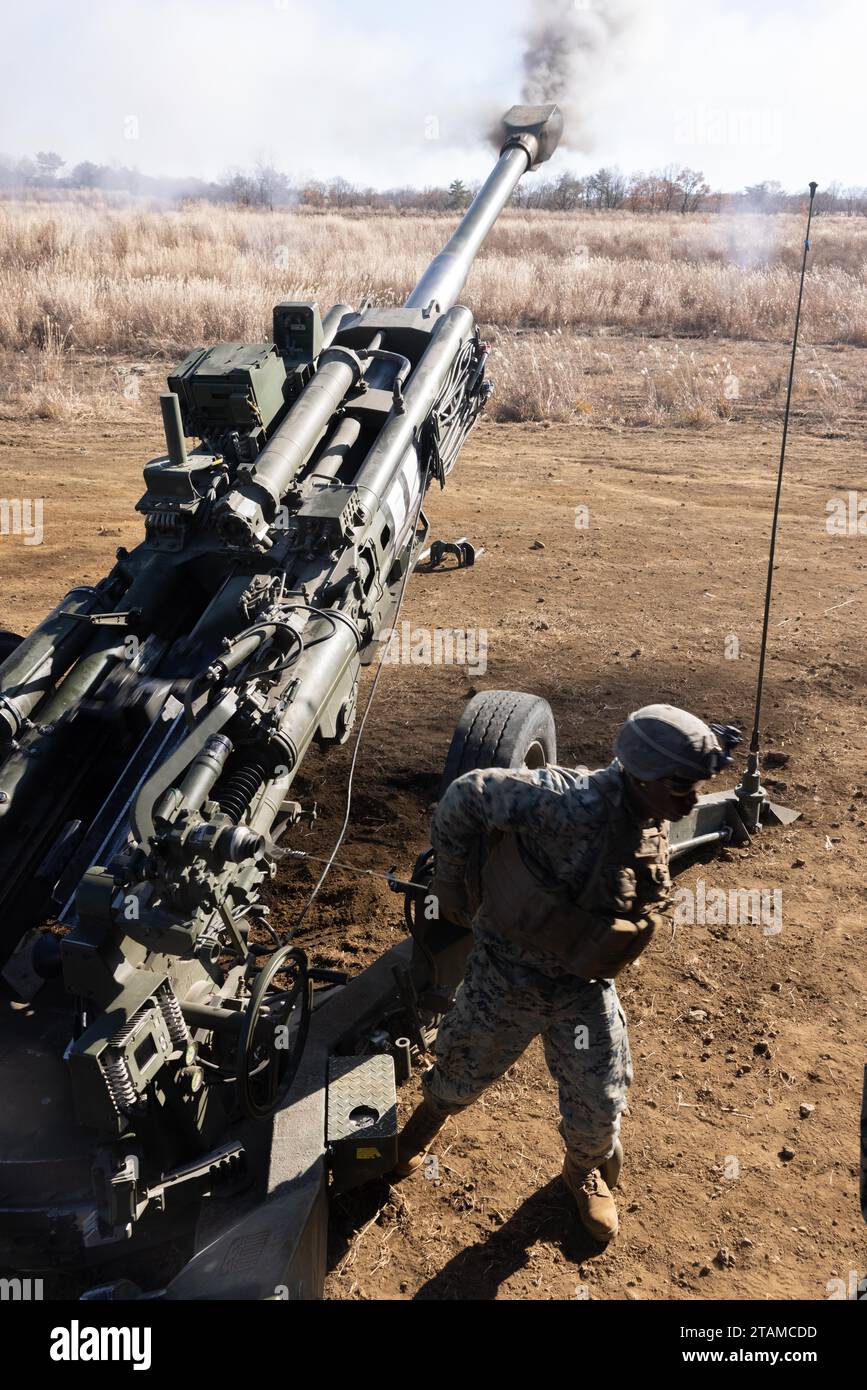 U.S. Marine Corps Cpl. Freeman Diah fires an M777 Howitzer during ...