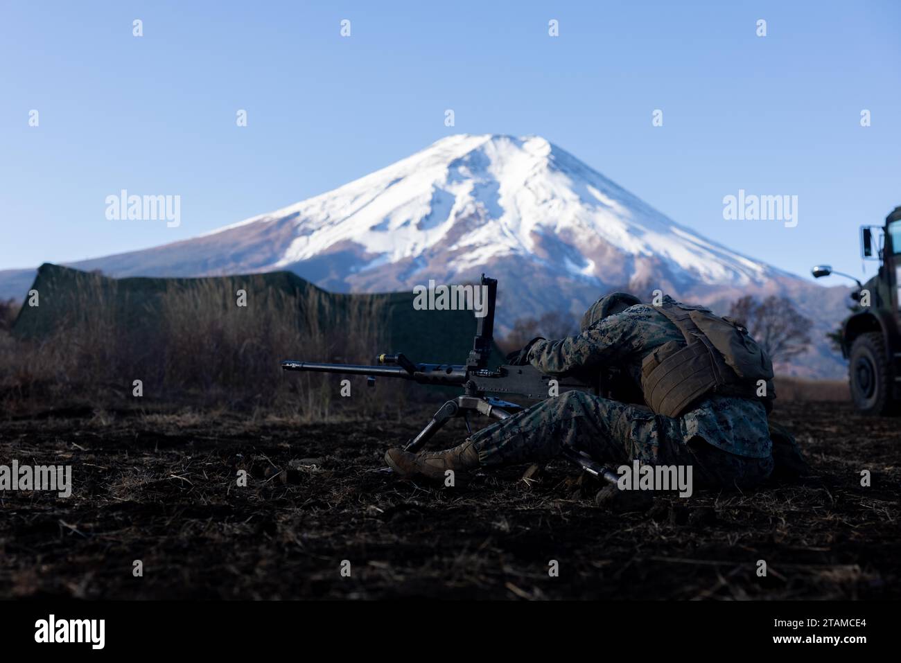 U.S. Marine Corps Lance Cpl. Rolando Romero clears an M2 Browning .50 ...